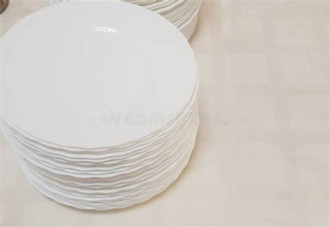 White Clean Empty Plates In A Stack On The Table Service In The Hotel