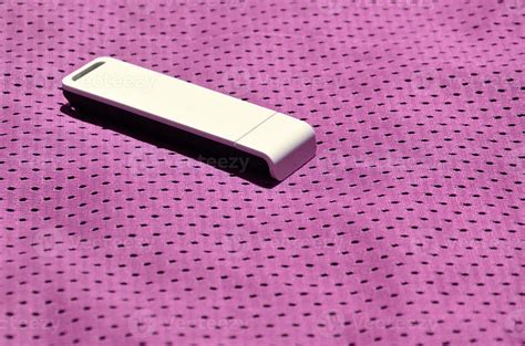 A Modern Portable Usb Wi Fi Adapter Is Placed On The Purple Sportswear
