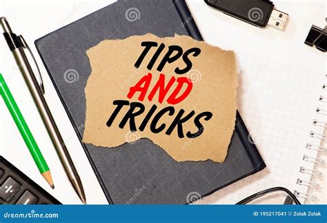 Words Tips Tricks On Notebook Office Desk With Electronic Devices