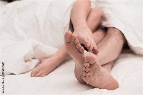Crossing Feet Of Couple In Bed Sex Concept Stock Photo Adobe Stock