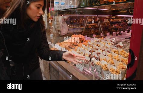 Madrid Spain Girl Tourist Watching Various Delicacies And Tasty Food