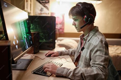 Premium Photo Teenage Boy Playing Video Games On Pc Computer