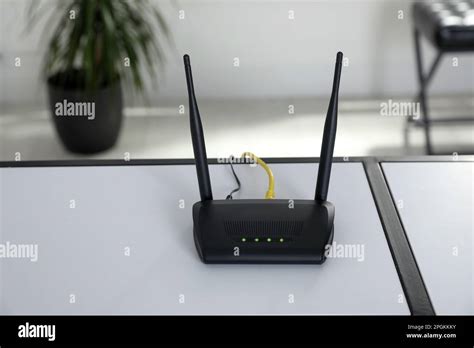 Modern Wi Fi Router On White Table Indoors Stock Photo Alamy