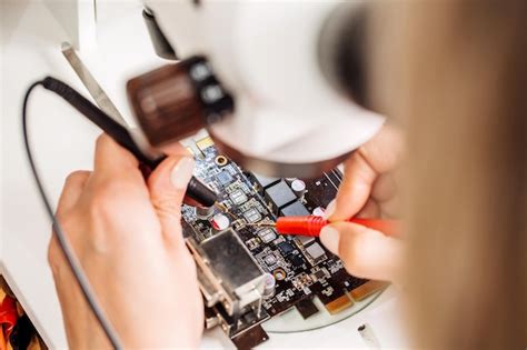 Premium Photo Woman Repairing Computer Hardware In Service Center Repairing And Fixing Service