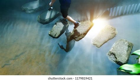 Man Walking On Stepping Stones
