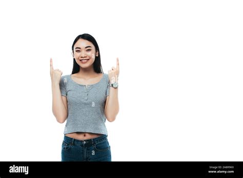 Happy Asian Girl Pointing With Fingers Upwards Isolated On White Stock