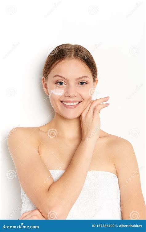 Laughing Positive Beautiful Half Naked Girl Applying Face Cream Stock