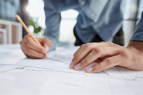 Premium Photo Engineer Designs Works According To Drawings And