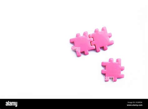 Three Pink Puzzle Pieces On A White Background Two Connected Forming A Seamless Link While