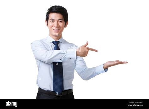 Portrait Of A Businessman Pointing At An Empty Object Stock Photo Alamy