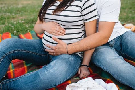Image Of Pregnant Couple Husband Touching His Wife Belly With Hands