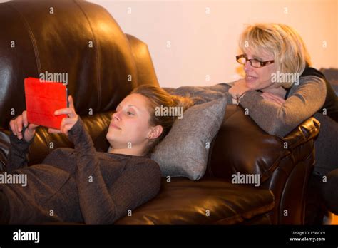 Two Women Using Digital Tablet Computer Stock Photo Alamy