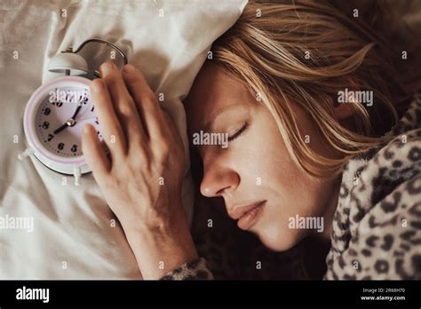 Alarm Clock And Sleeping Woman The Concept Of Sleep Problems Insomnia Circadian Rhythm Stock