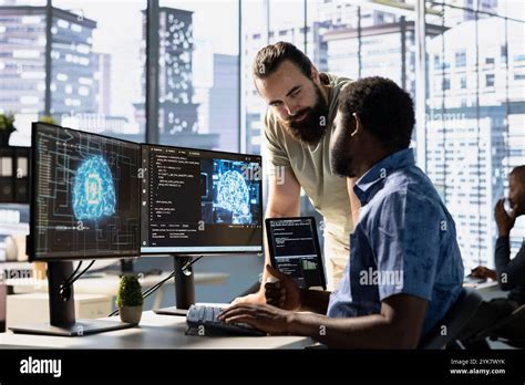 It Staff Members Testing And Deploying Artificial Intelligence Programs