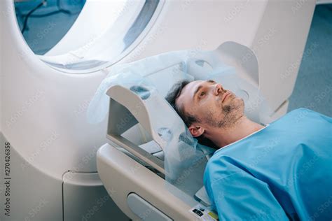 Adult Handsome Man Lying On Ct Scan Bed During Tomography Test Stock Photo Adobe Stock