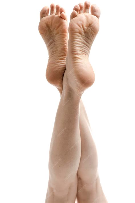 Premium Photo Beautiful Womans Bare Feet Against A White Background