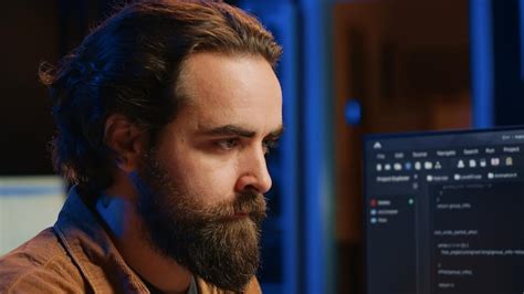 premium photo software technician in apartment office deeply immersed in coding close up