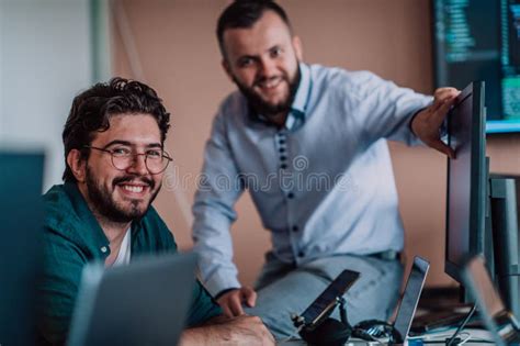 Programmers Engrossed In Deep Collaboration Diligently Working