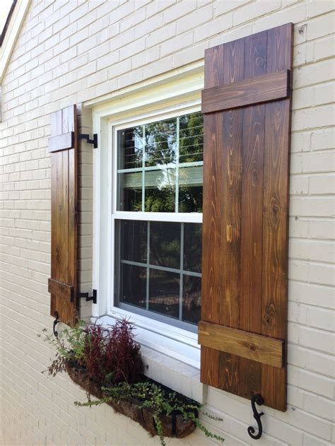 Hung Wooden Shutters With Hardware