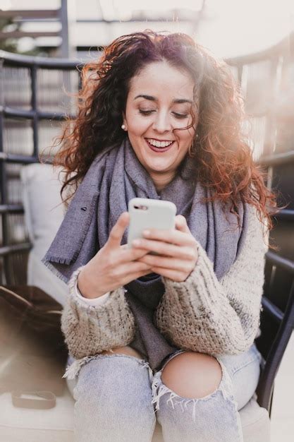Premium Photo Portrait Of Smiling Woman Using Mobile Phone