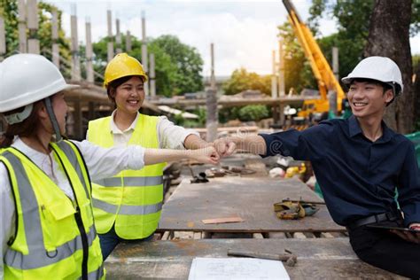 Structural Engineer And Architect Discussing And Working With