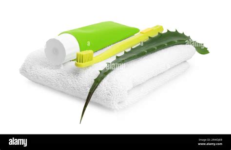 Tube Of Toothpaste Brush Aloe Vera Leaf And Towel On White Background
