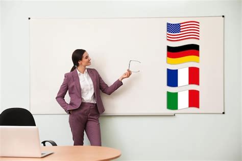 Premium Photo Foreign Languages Teacher Near Whiteboard With Different Flags In Modern Classroom Premium Photo Foreign Languages Teacher Near Whiteboard With Different Flags In Modern Classroom