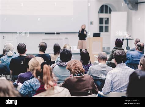 Female Speaker Giving Presentation On Business Conference Stock Photo Alamy