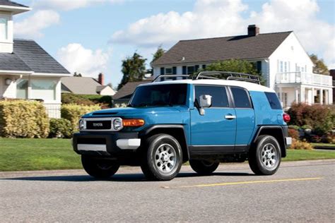 2024 Toyota Fj Cruiser In Blue Color Parked In Front Of Houses