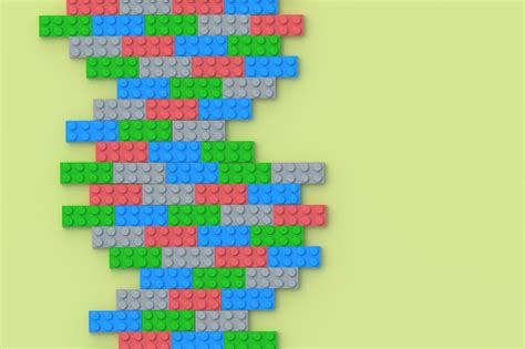 노란색 배경에 화려한 플라스틱 장난감 블록 개발 자식용 직사각형 형상 생성자입니다 유치원 에서 교육을위한 벽돌 생성자 부품입니다 공간을 복사합니다 3d 렌더링 개발에 대한