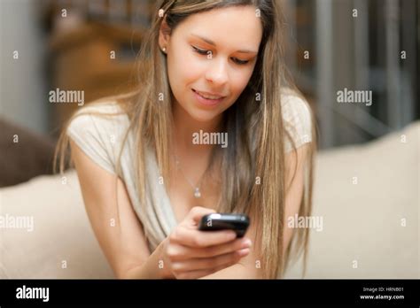 Woman Sending A Text Message Stock Photo Alamy