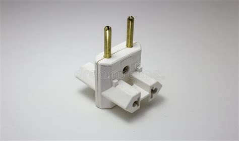 Travel Power Adapter Made Of Plastic And Metal For Different Electrical Socket Standards Stock