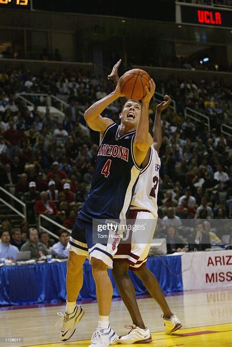 Luke Walton Of The Arizona Wildcats Puts A Shot Up Past Ebi Ere Of