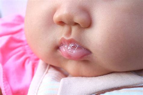 Why Your Baby Spits Up Clear Liquid And How To Prevent It