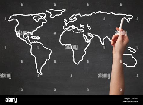 Adult Drawing World Map On Chalkboard Stock Photo Alamy