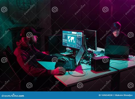 Wanted Hackers Coding Virus Ransomware Using Laptops And Computers In The Basement Cyber Attack