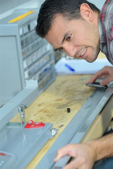 Man Measuring Off Metal Bar In Workshop Stock Photo Image Of Material Object 261156768