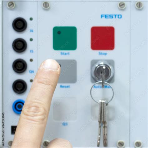 Male Hand Pushing Stop And Reset Buttons Of Control Panel For Electrical Equipment In A Smart