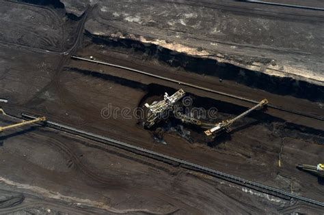 Top View Of A Mining Quarry With Huge Equipment For Coal Or Natural Raw Material Mining Working