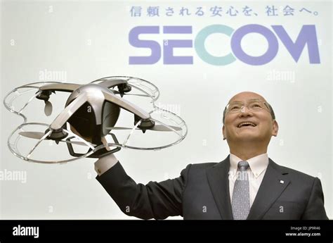 Hiroshi Ito President Of Security Company Secom Co Holds Up A Drone