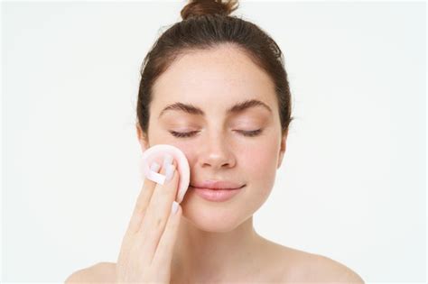 Free Photo Image Of Young Woman Taking Off Her Makeup With Cotton