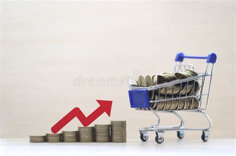 global inflation or deflation concept red arrow graph on stack of coins money and model