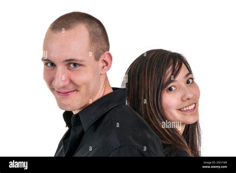 Side Head And Shoulder View Of A Young Heterosexual Couple Of Caucasian And Asian Descent