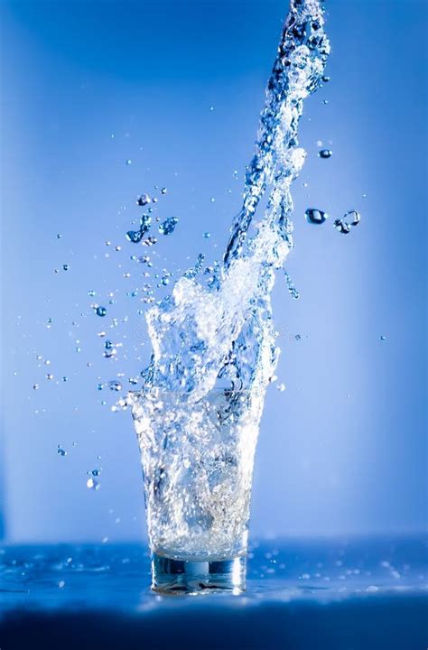 Pouring Water Into Glass Stock Image Image Of Spilling 18874129