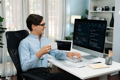 It Developer Looking Camera Holding Coffee Cup With Coding On Pc