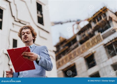 Corporate Architects Discussing Sustainable Design And Project Costs In