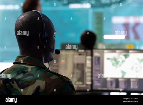 Military Personnel Operating On Cctv Reconnaissance System In Command Post Gathering