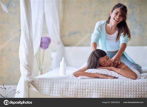 Young Lesbian Couple Enjoying Massage Relaxed Atmosphere Bedroom
