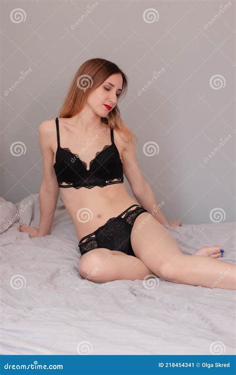 Seductive Redhead Woman In Black Lingerie On Bed With Grey Sheets Stock Image Image Of Bedroom