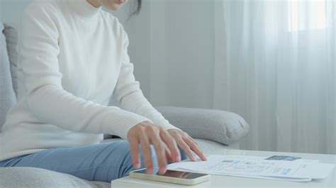 Modern Woman Use Phone To Scan Barcode Or QR Codes To Pay Credit Card Bill After Receiving